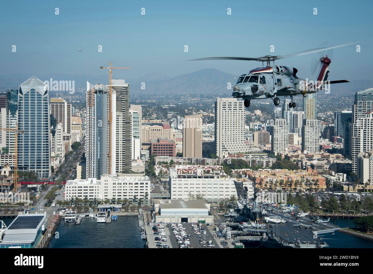 An MH-60R Sea Hawk helicopter flying above San Diego, California Stock ...