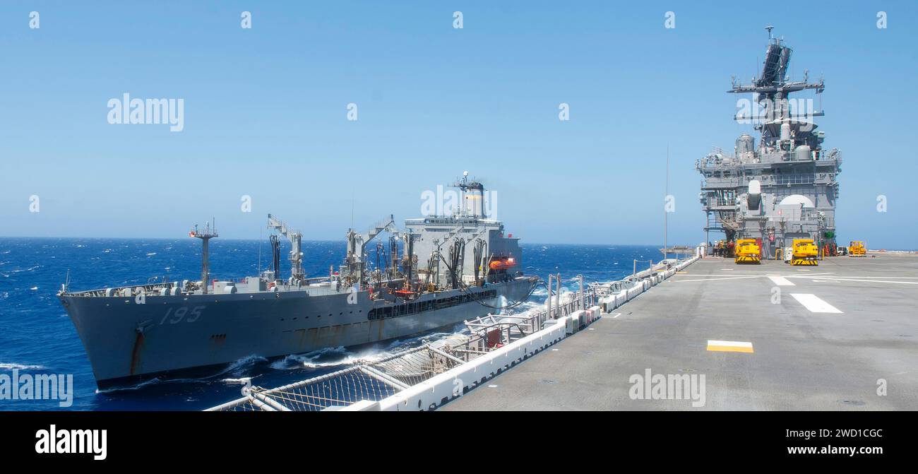 The fleet replenishment oiler USNS Leroy Grumman pulls alongside USS ...