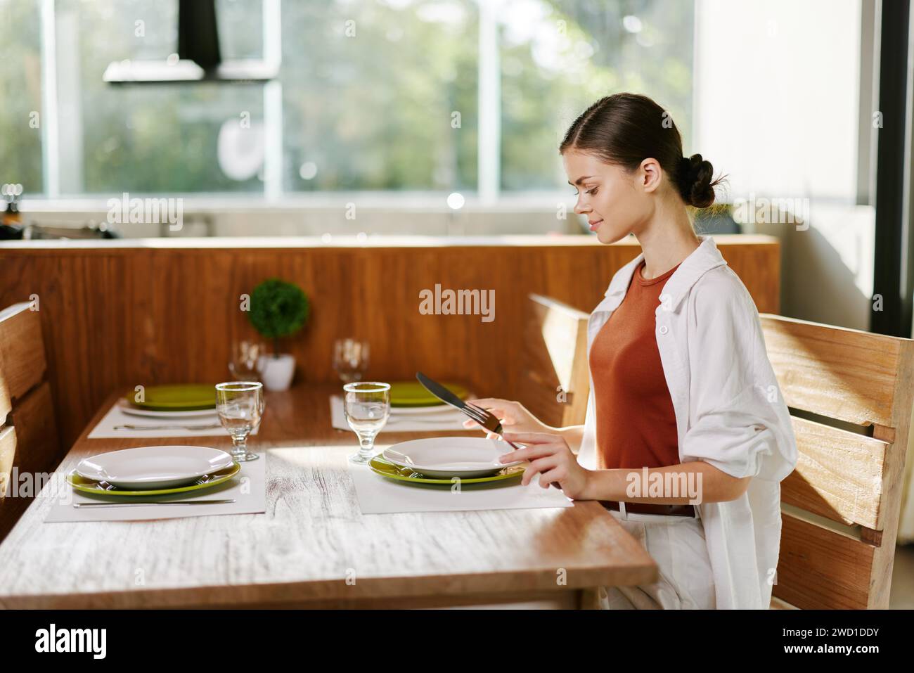 Stylish woman sitting at dining table with beautiful smile, home modern ...