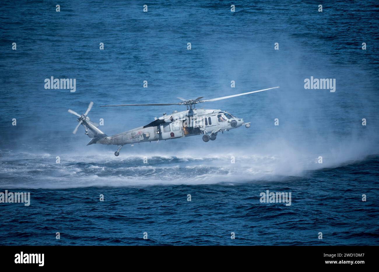 An MH-60S Sea Hawk helicopter hovers above the water Stock Photo - Alamy
