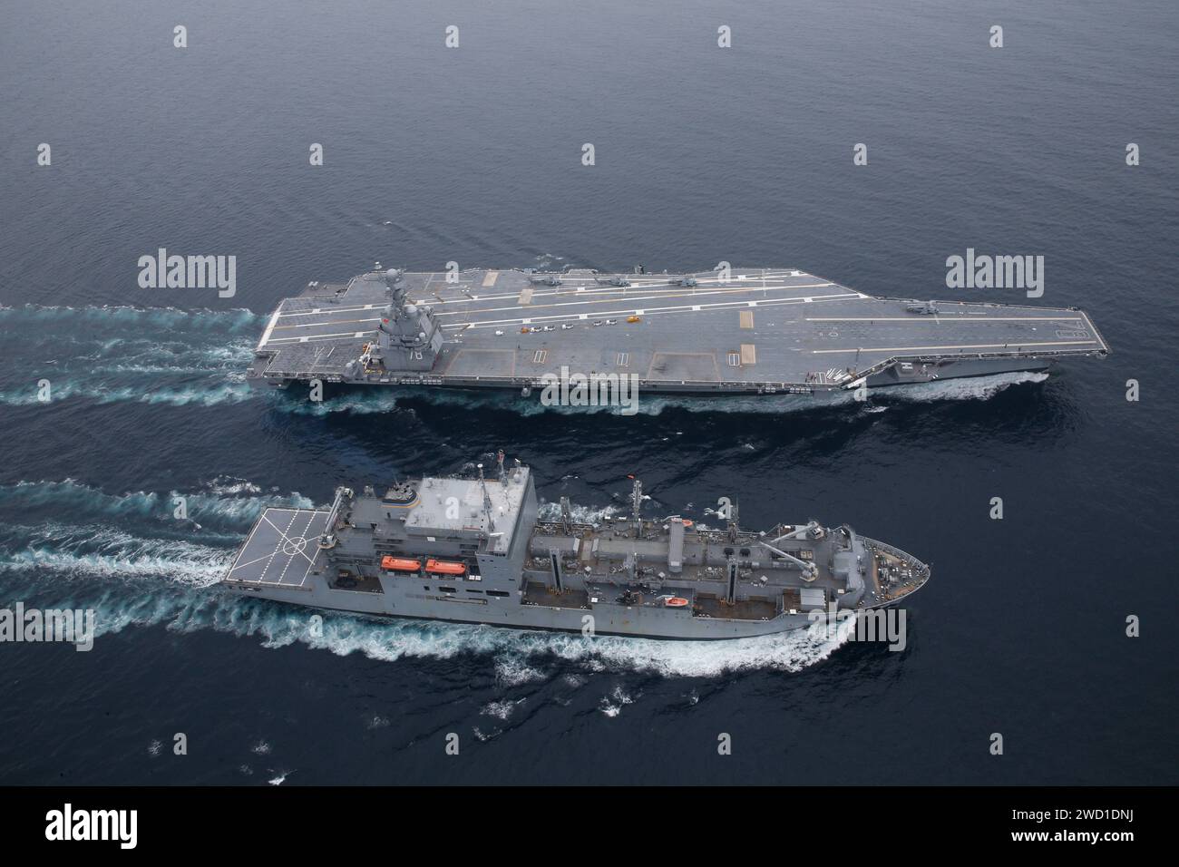 USS Gerald R. Ford pulls alongside the dry cargo and ammunition ship ...