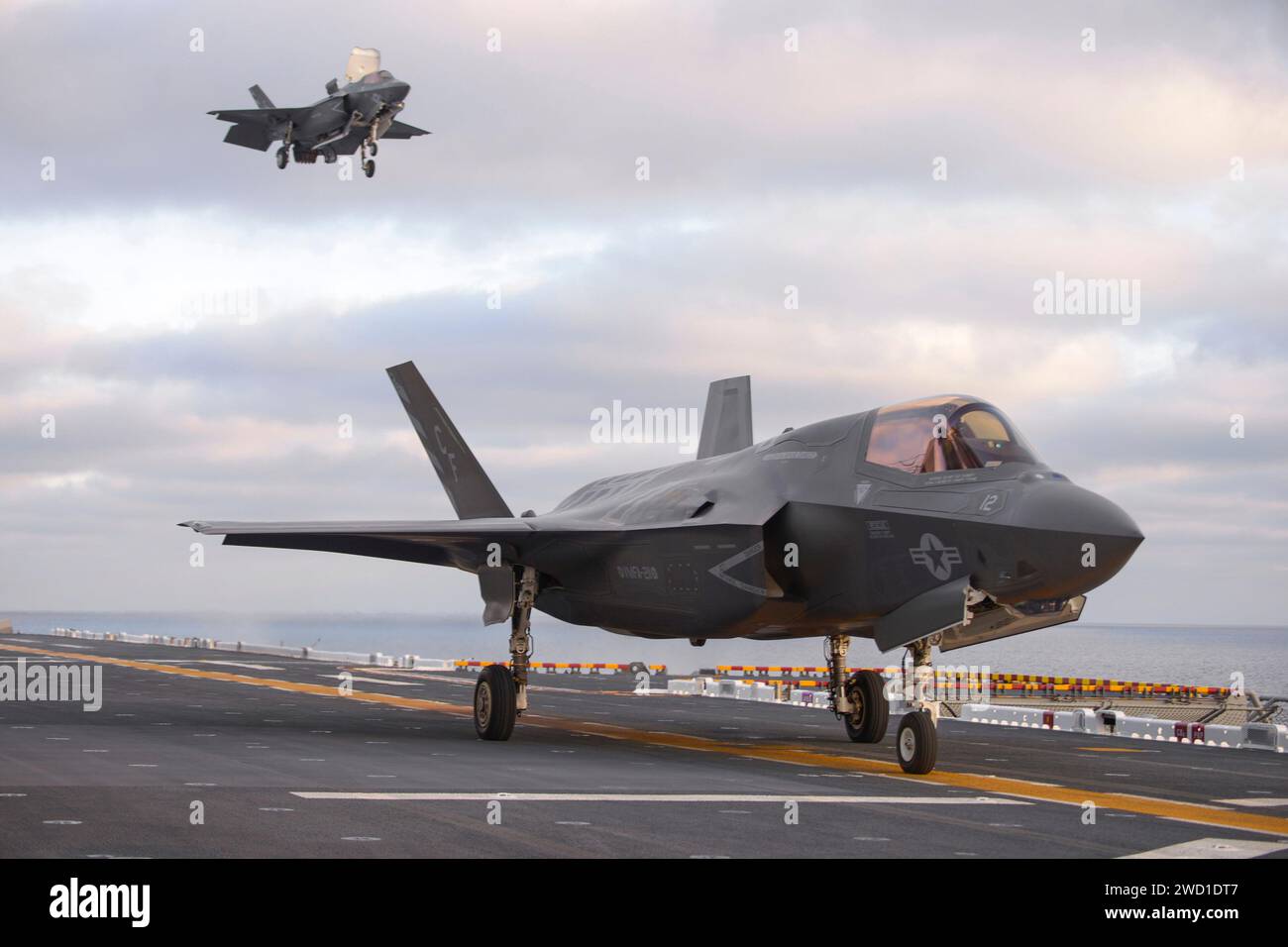 An F-35B Lightning II Joint Strike Fighter awaits take off aboard USS ...