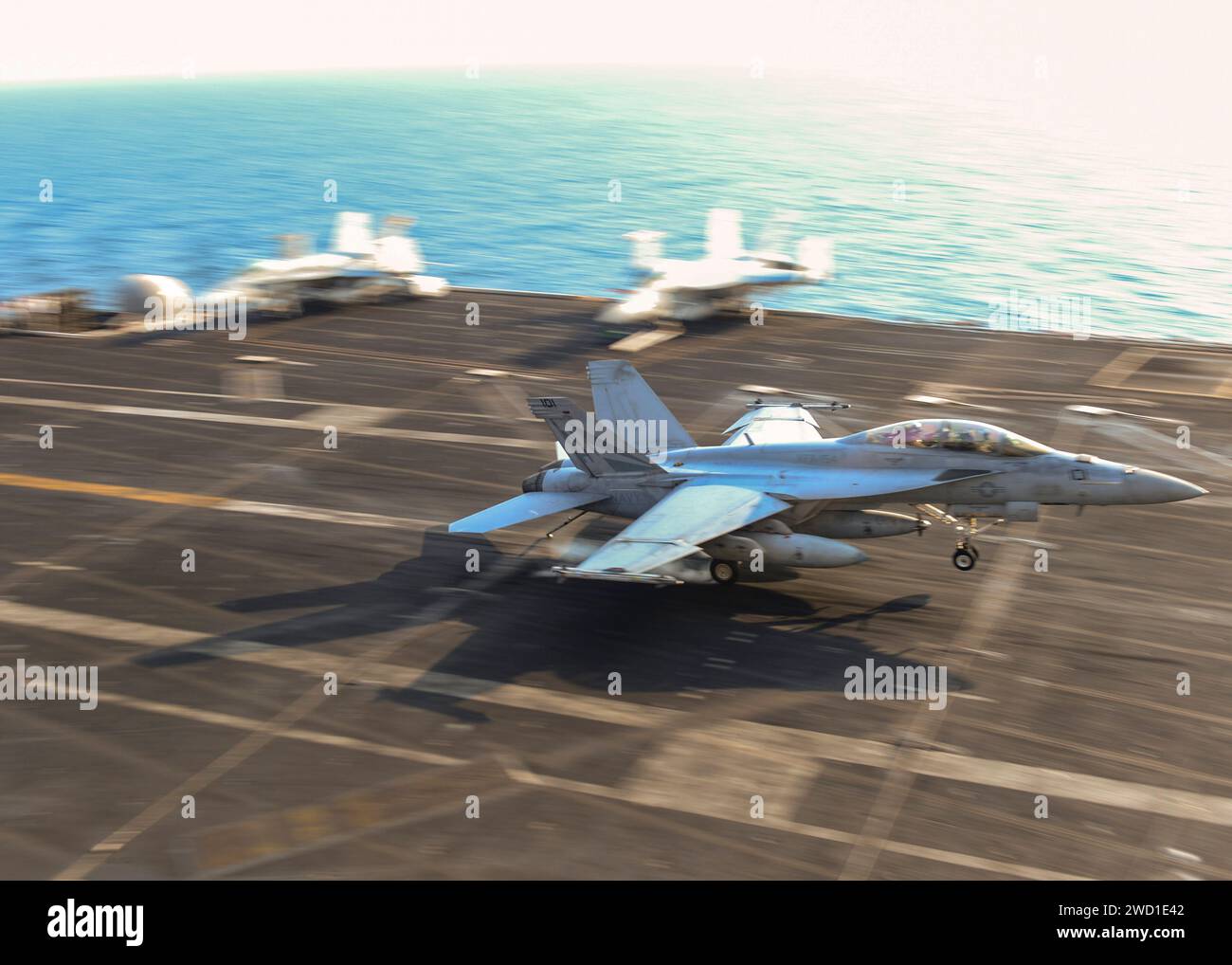 An F/A-18F Super Hornet lands on the flight deck of USS Nimitz in the ...