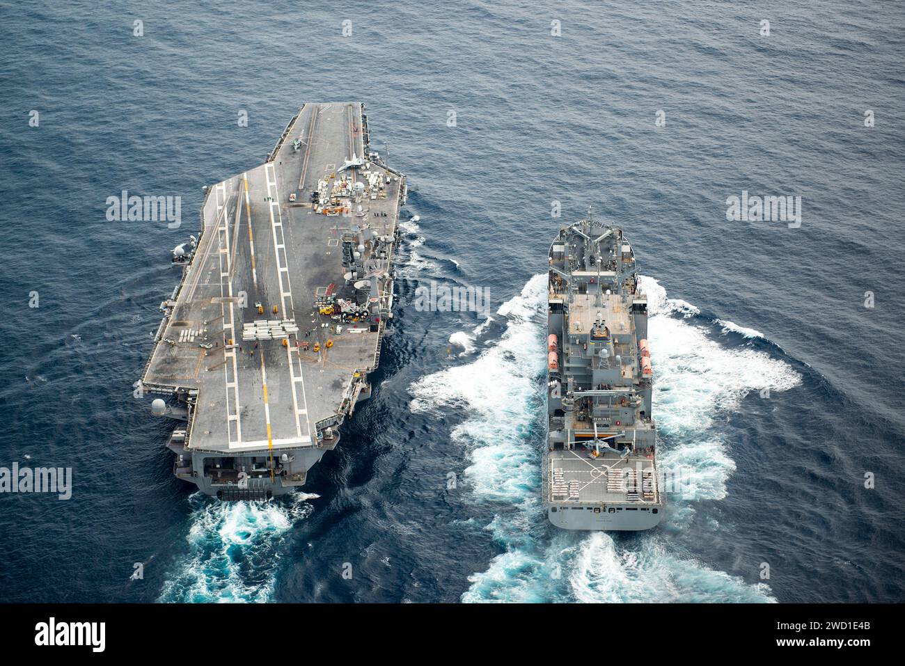 USS Harry S. Truman conducts an ammunition onload with the dry cargo ...