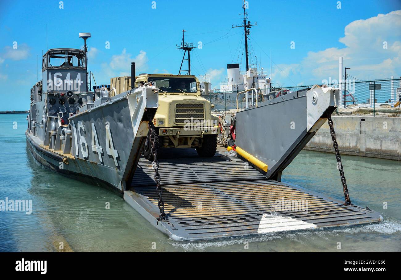 Landing Craft Unit delivers equipment and supplies to assist with ...