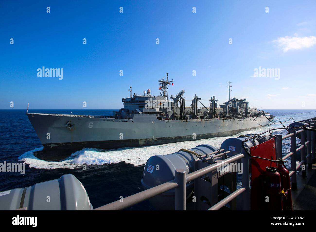 The fast combat support ship USNS Supply refuels USS Iwo Jima off the ...