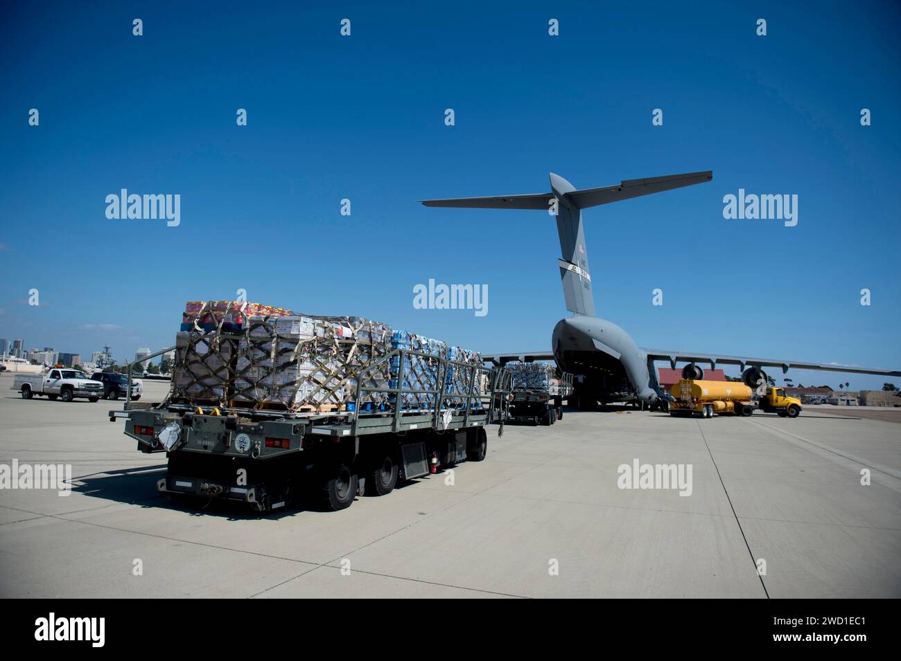 127,000 pounds of food and water onto a C-17 Globemaster III at Naval ...