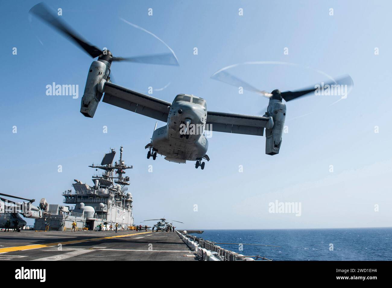 An MV-22 Osprey lifts off from the flight deck of the amphibious ...