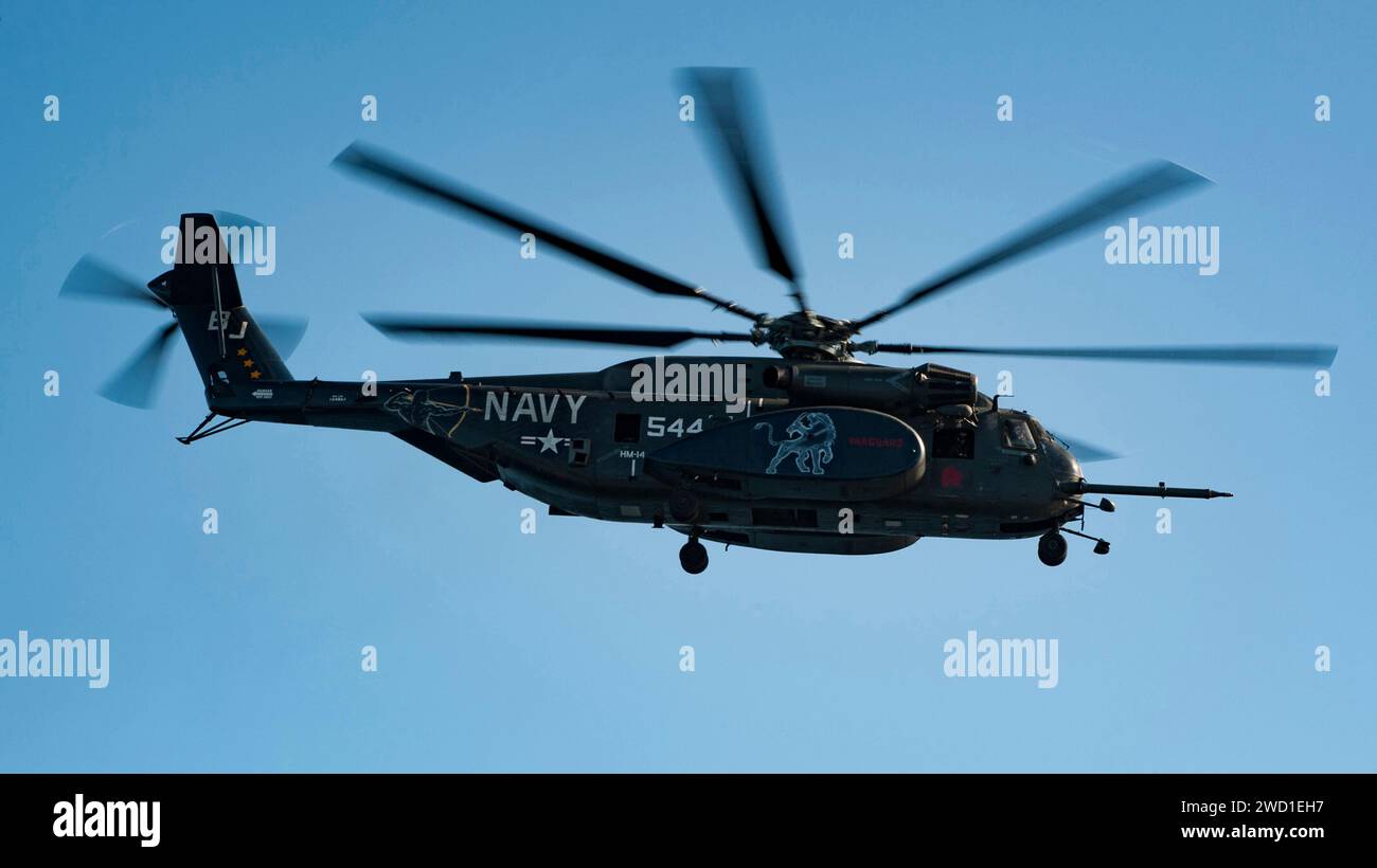 An MH-53E Sea Dragon helicopter launches off the amphibious assault ...