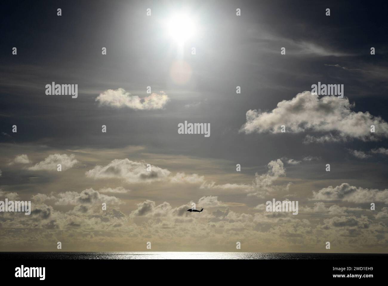 An MH-60S Sea Hawk helicopter flies over the Atlantic Ocean Stock Photo ...
