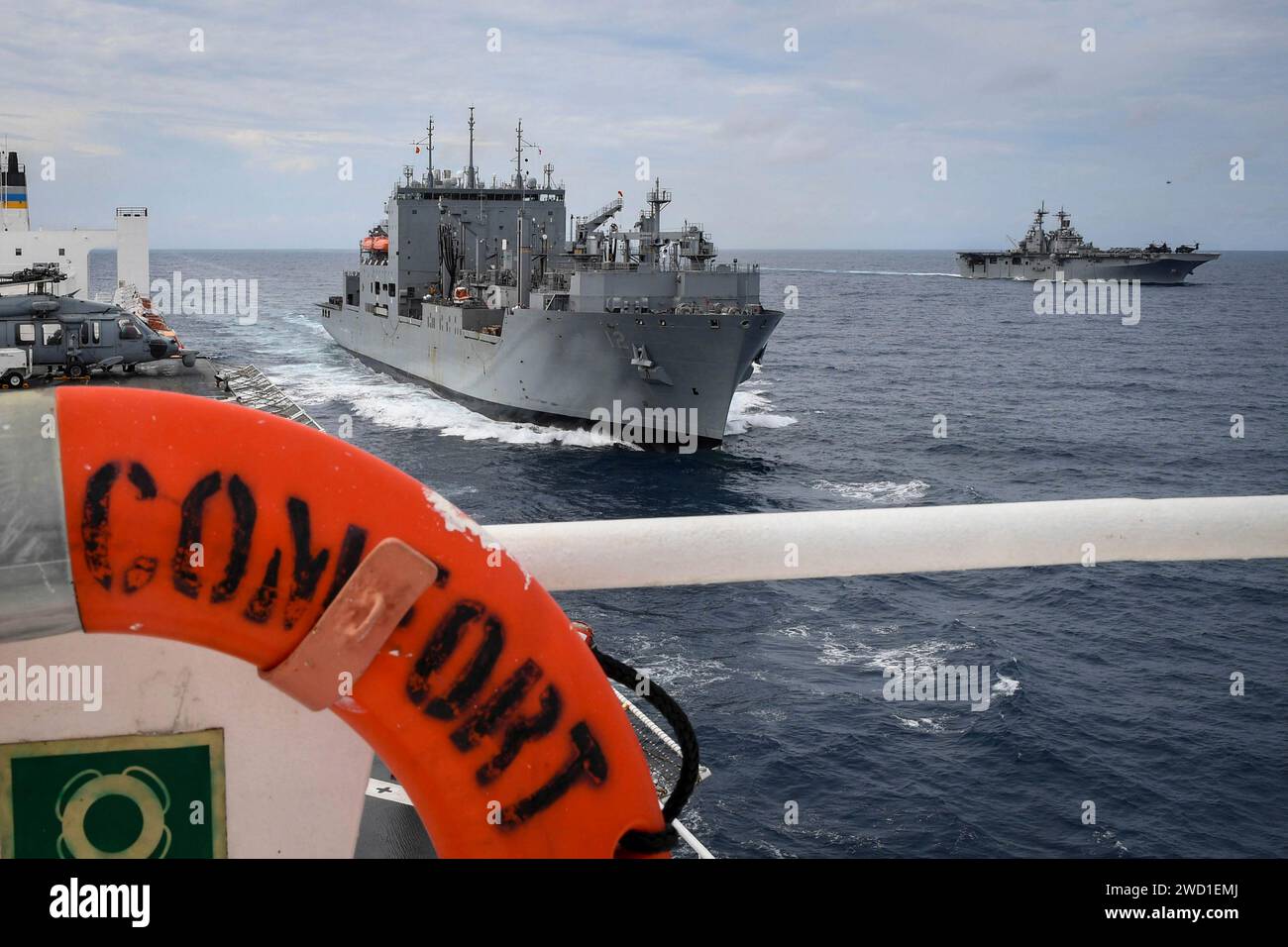 USNS Comfort and USS Wasp come alongside USNS William McLean for a ...