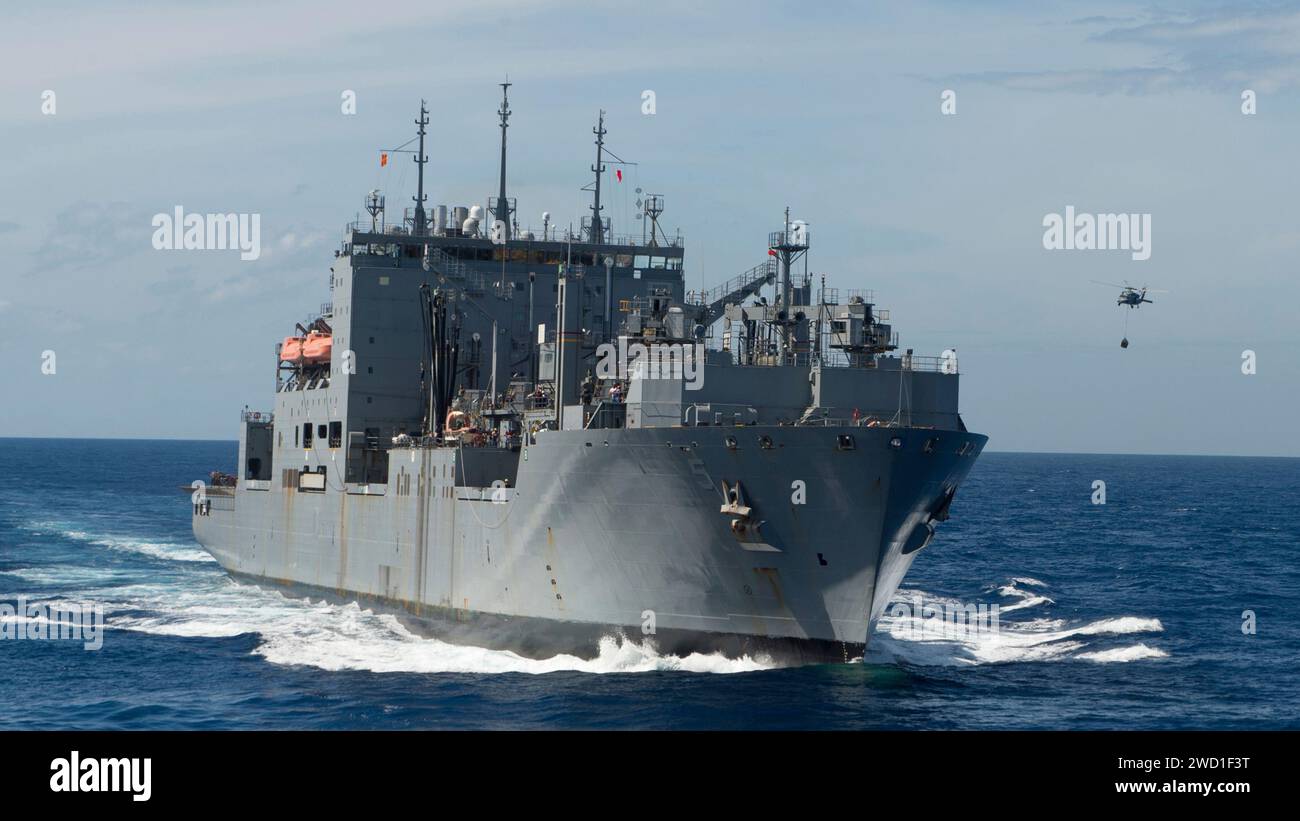 The dry cargo and ammunition ship USNS Robert E. Peary transits the ...