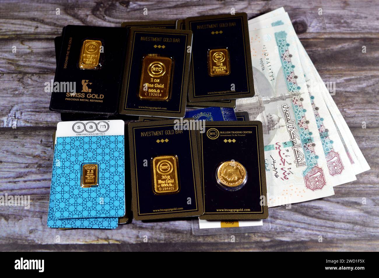 Cairo, Egypt, January 15 2024: Egyptian pounds money and pile of 24K ...