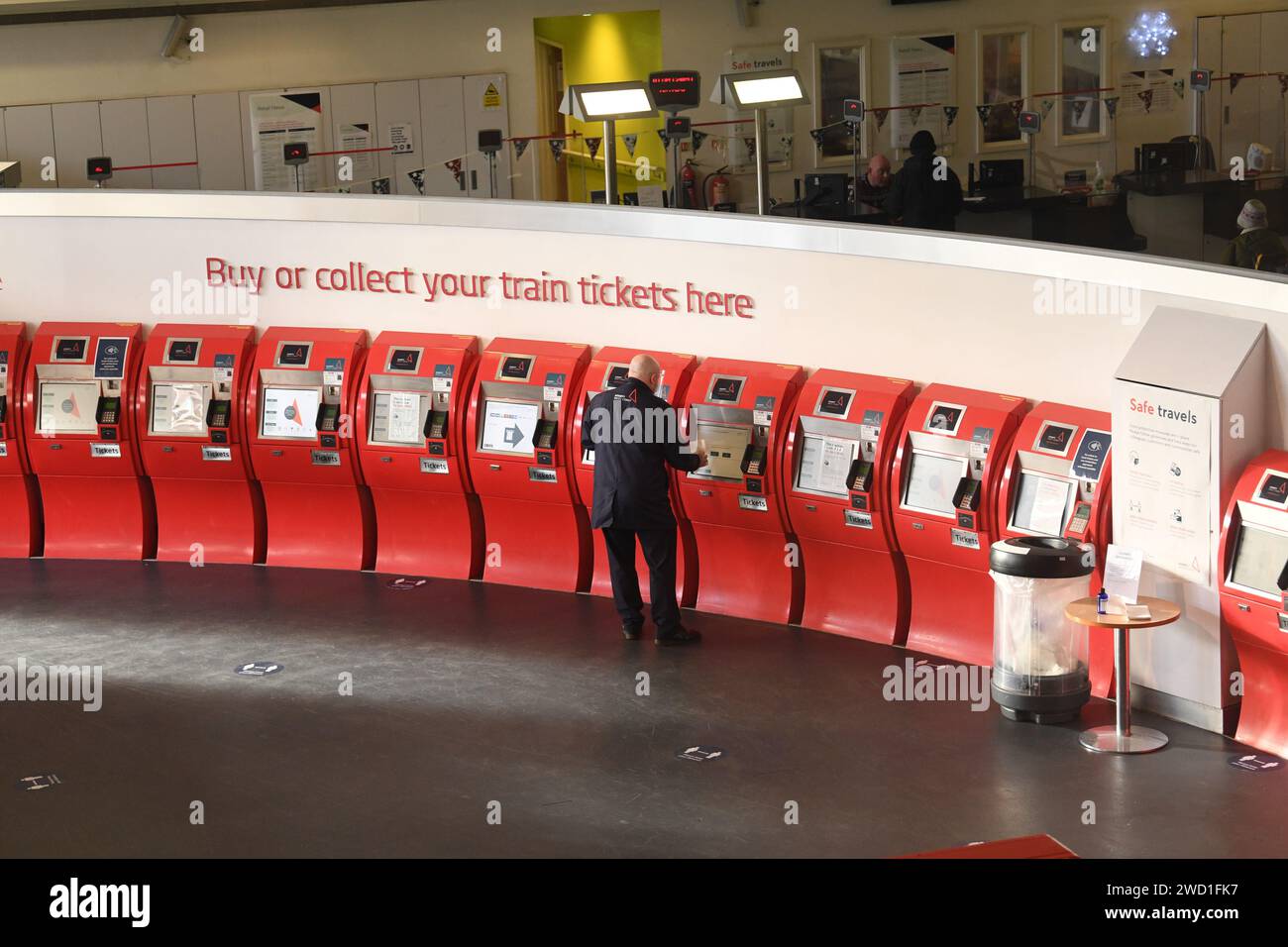 File photo dated 20/12/2020 of a station employee at the ticket ...