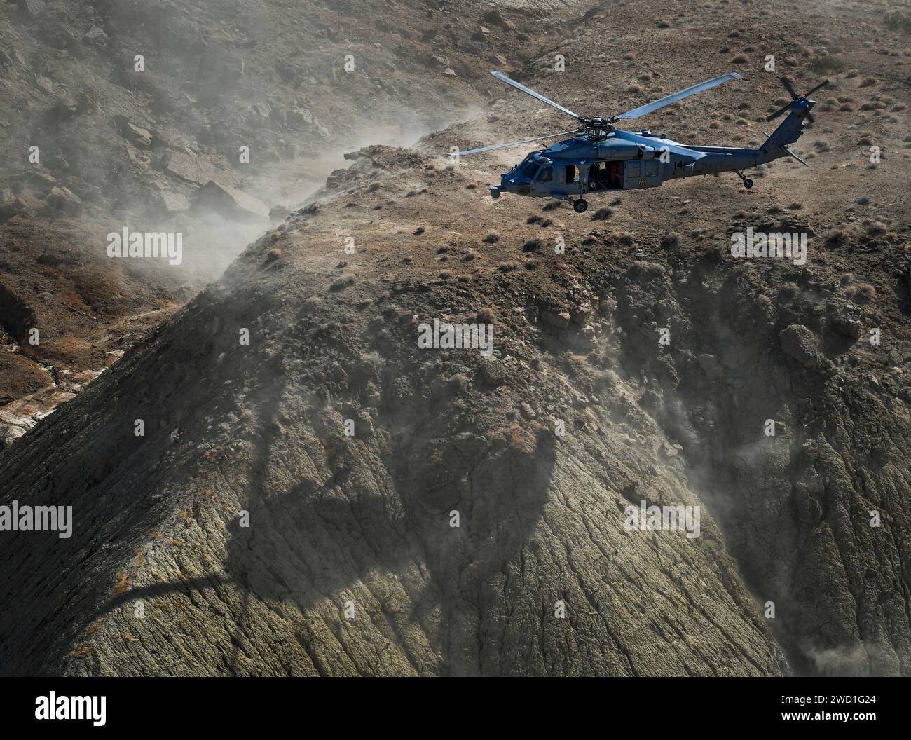 An MH-60S Sea Hawk helicopter practices terrain flight tactical ...