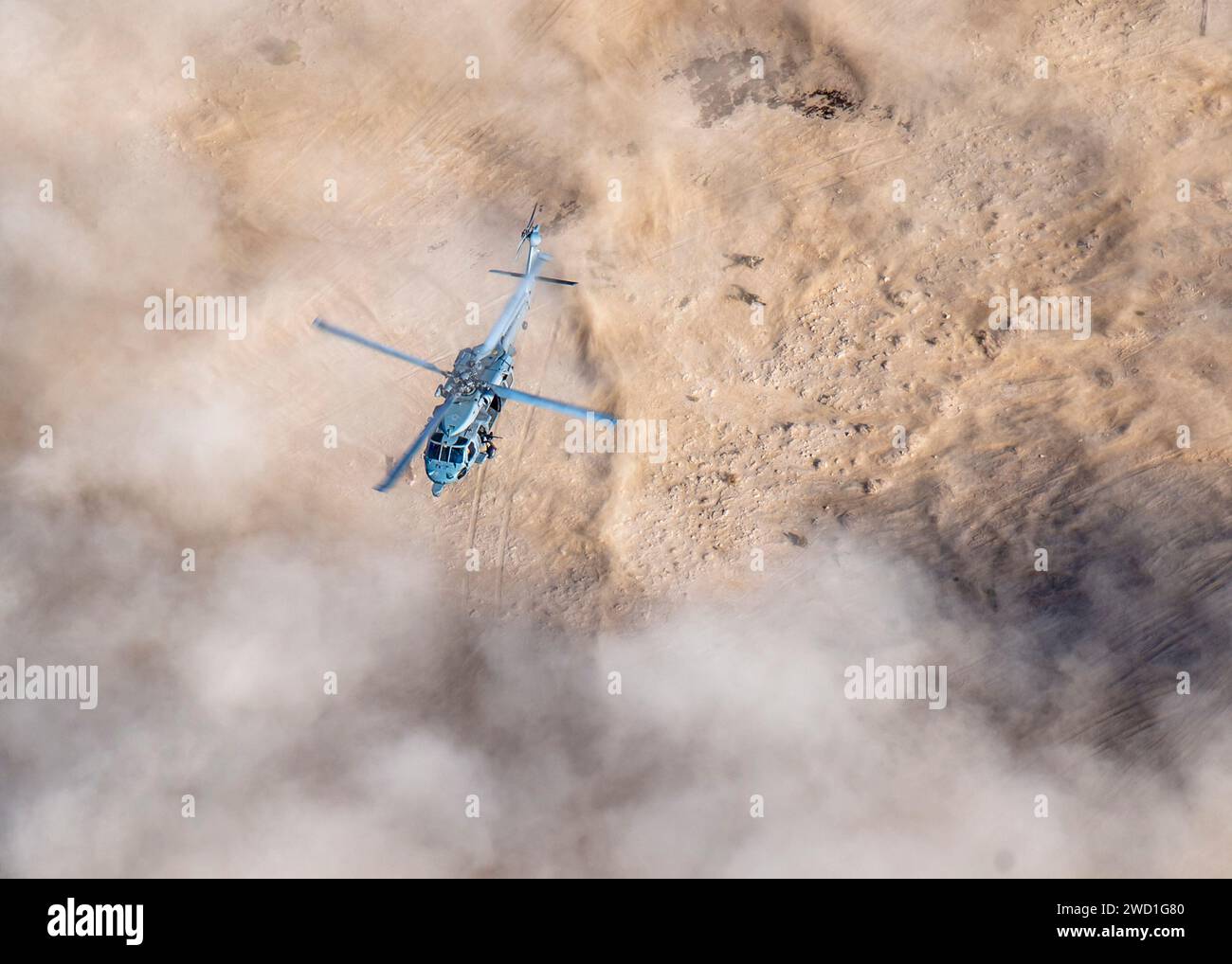 A MH-60S Sea Hawk helicopter performs a tactical flight maneuver ...