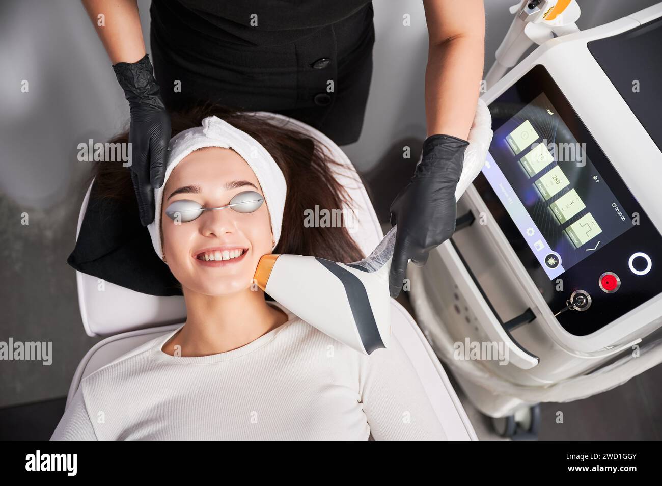 Woman receiving innovative procedure hi-res stock photography and ...