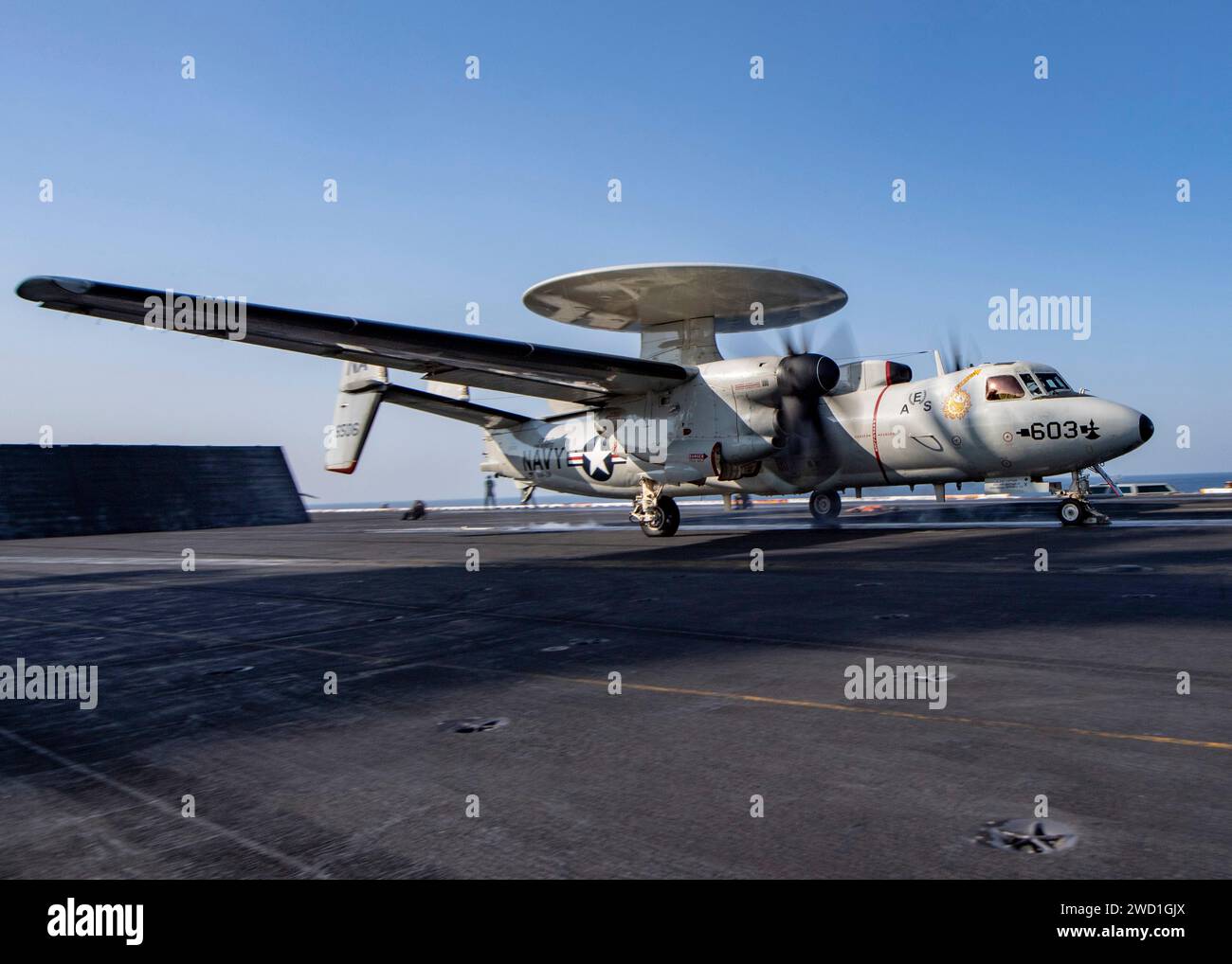 An E-2C Hawkeye launches off the flight deck of the aircraft carrier ...