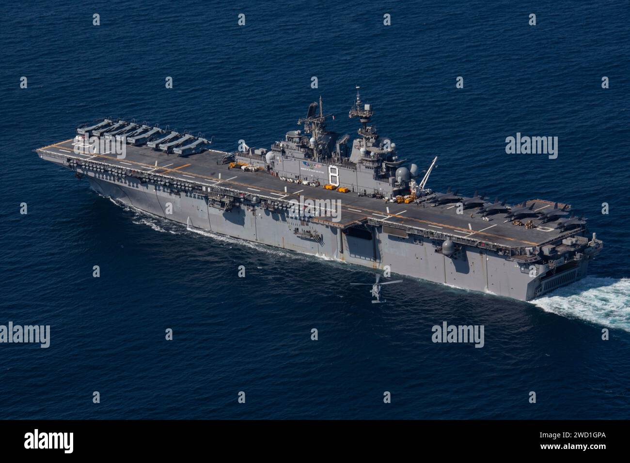 The amphibious assault ship USS Makin Island steams through the eastern ...