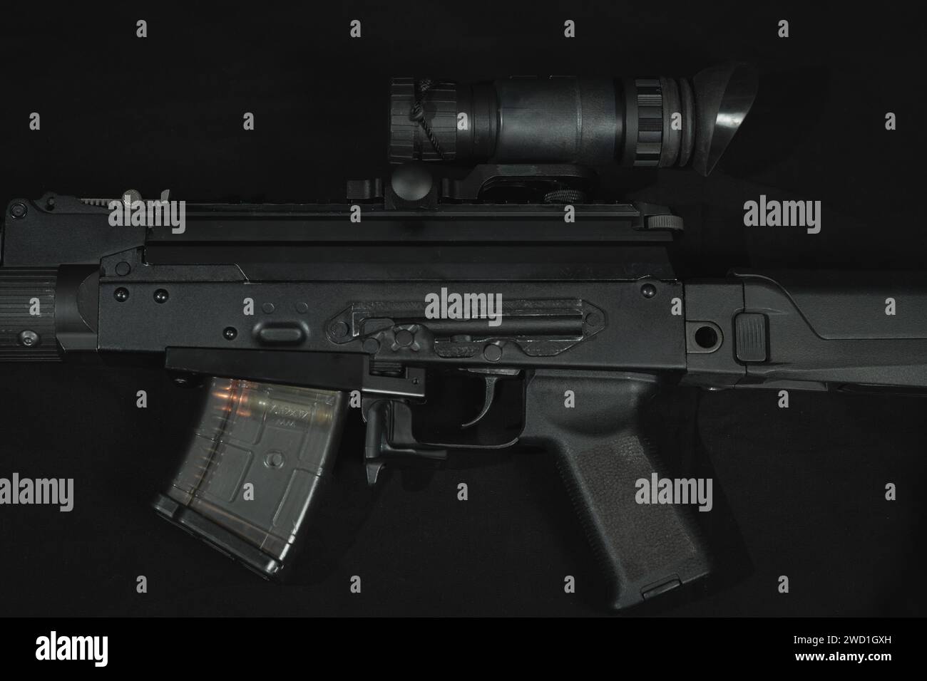 AKM assault rifle with night vision device, close-up photo. High ...