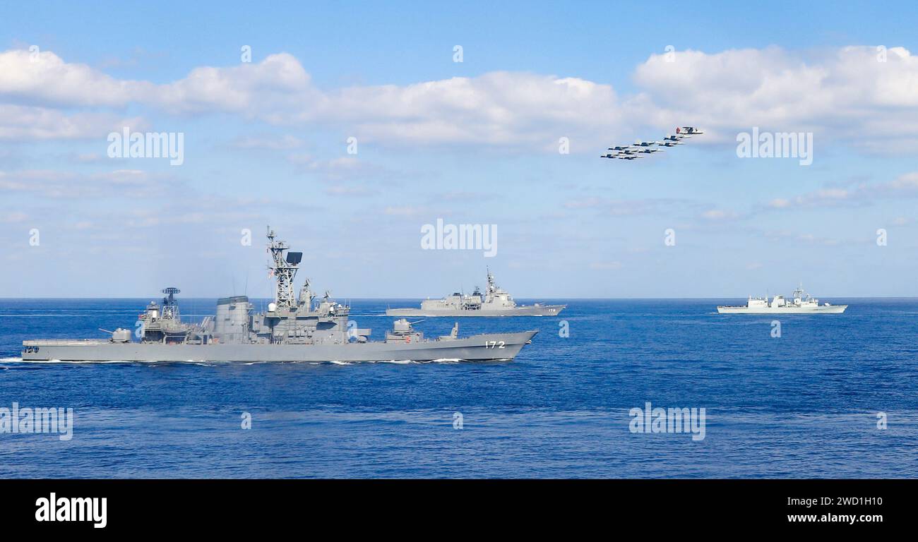 Aircraft fly above Japanese Navy ships JS Shimakaze, JS Ashigara and ...