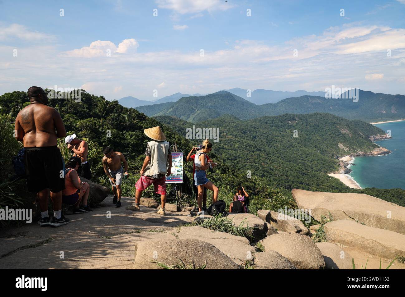 Rio De Janeiro, Brazil. 10th Jan, 2024. A group hikes to the "Pedra do ...