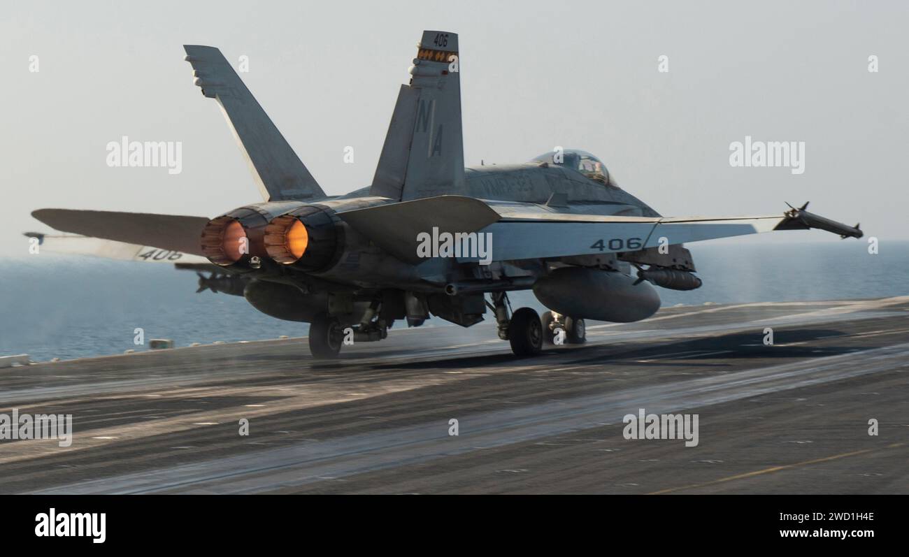 An F/A-18C Hornet aunches off the flight deck of the aircraft carrier ...