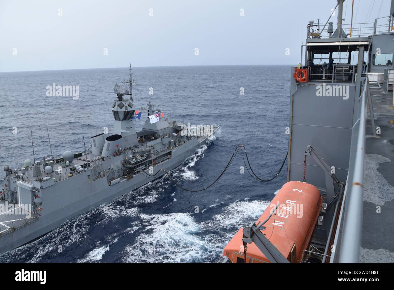 The Royal Australian Navy Frigate In The Hmas Ballarat Alongside Dry Cargo Ship Usns Amelia