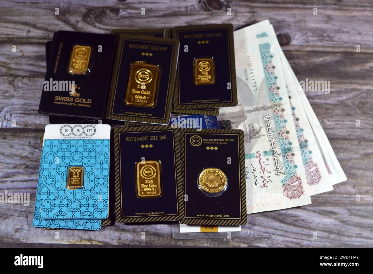 Cairo, Egypt, January 15 2024: Egyptian pounds money and pile of 24K ...