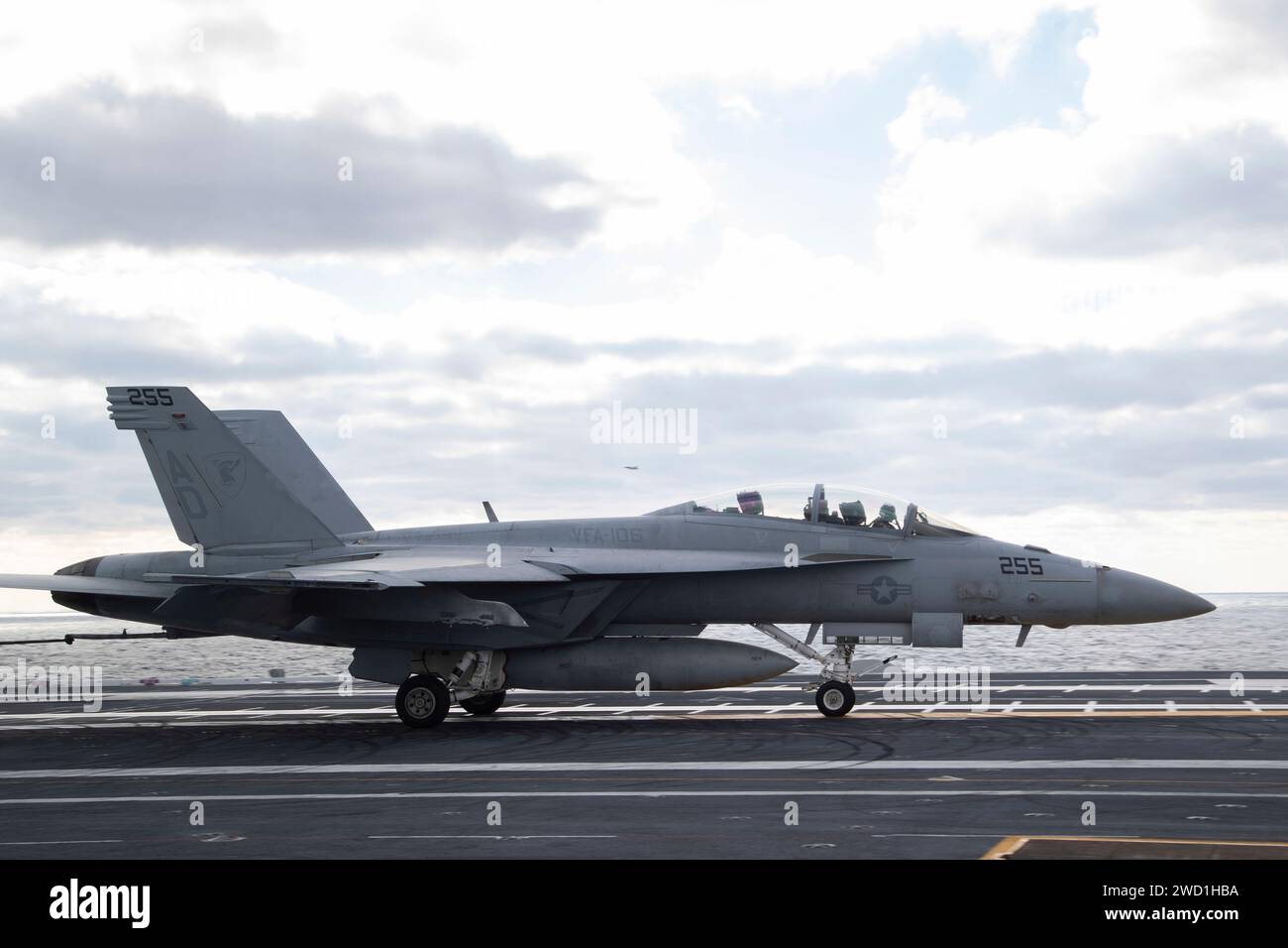 An F/A-18F Super Hornet lands on the flight deck of the aircraft ...