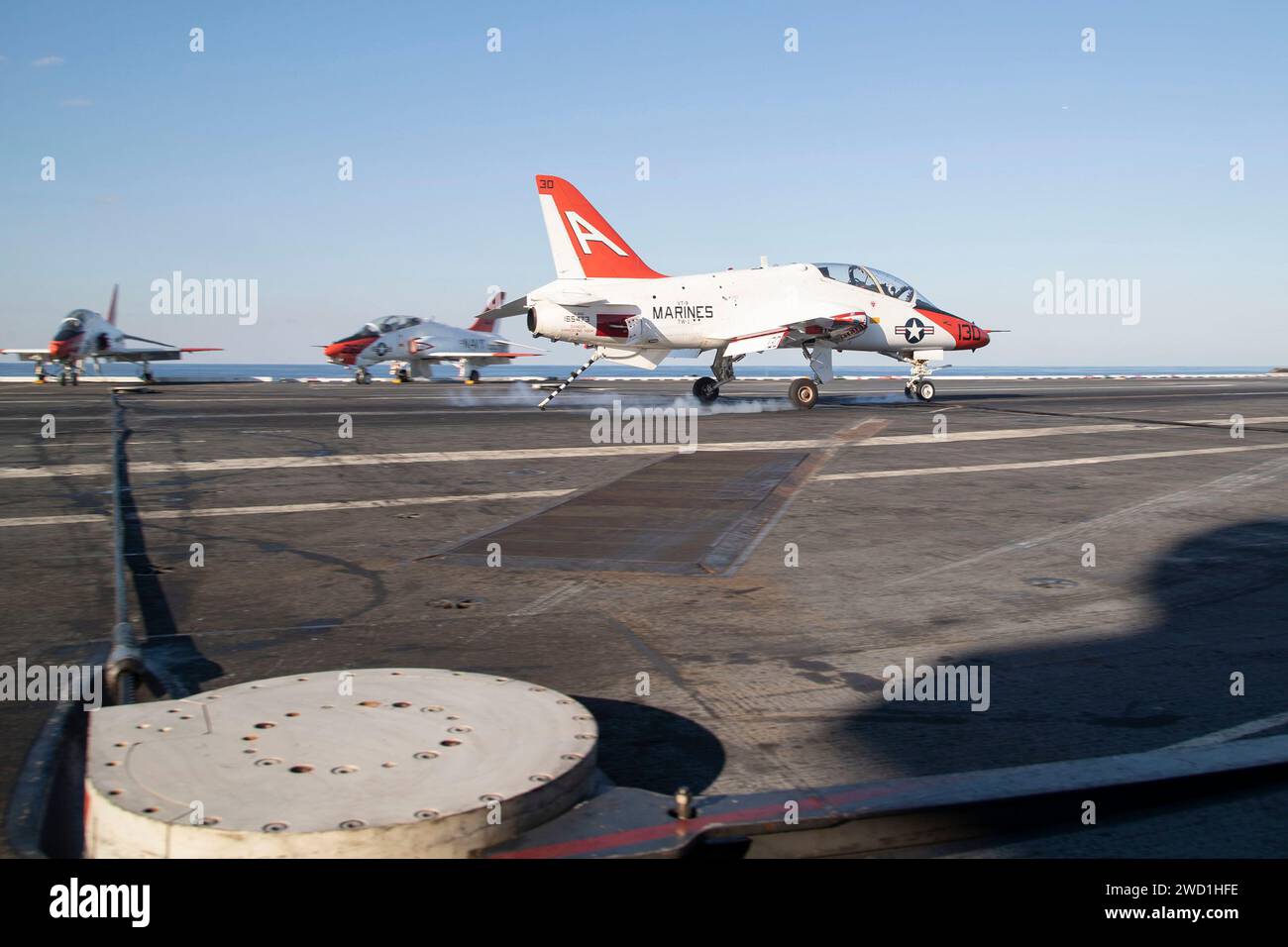 A T-45C Goshawk lands aboard the aircraft carrier USS Gerald R. Ford ...