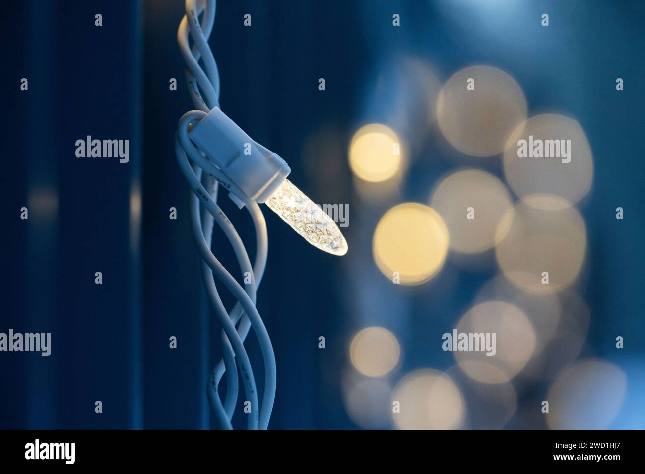 Single white light in focus with out of focus lights in the distance ...