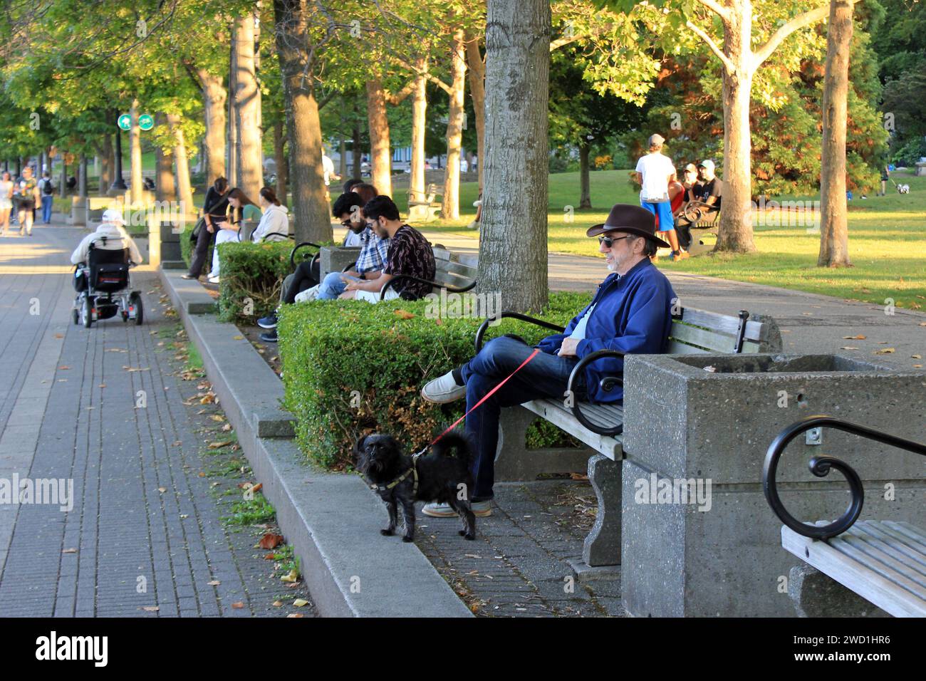 A group of people sitting in downtown Vancouver, British Columbia ...