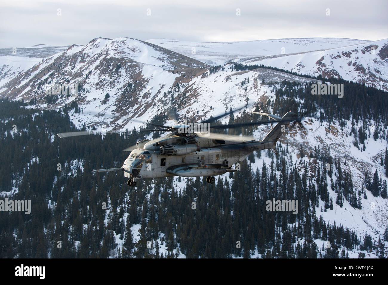 A U.S. Marine Corps CH-53E Super Stallion flies over the Rocky ...