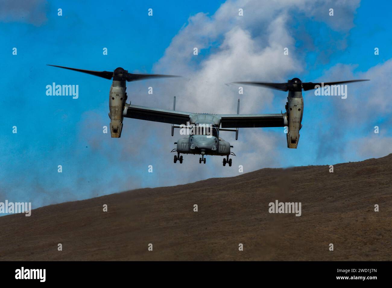 A U.S. Marine MV-22b Osprey on approach to a landing zone on the island ...