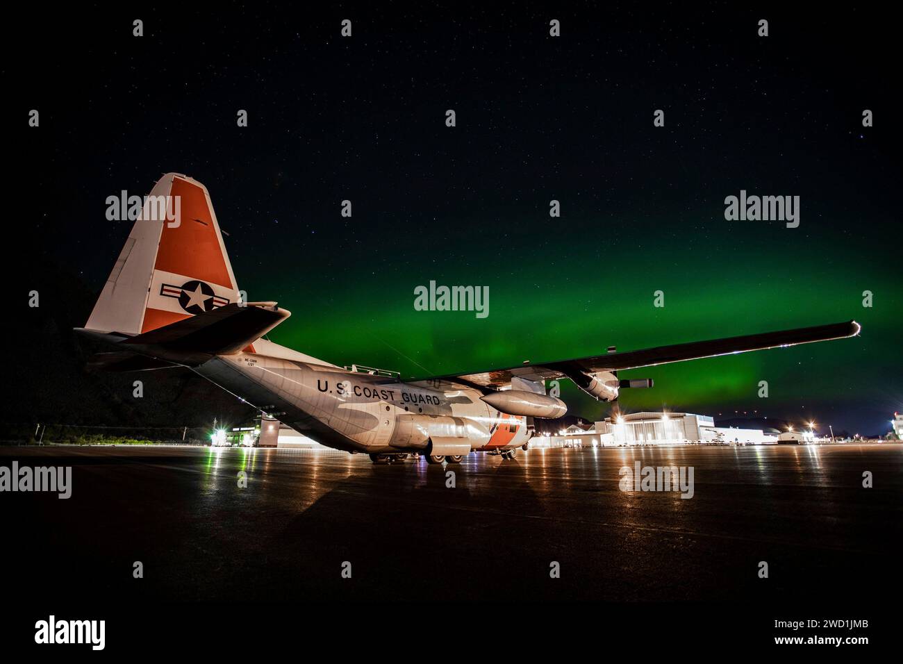 A Coast Guard Air Station Kodiak HC-130 Hercules aircraft parked on the ...