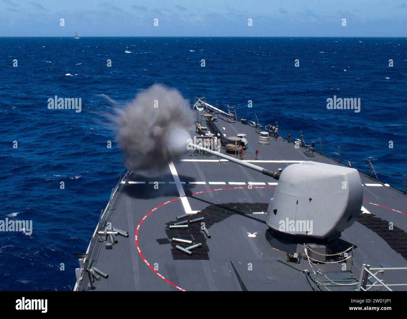 Guided-missile destroyer USS Curtis Wilbur fires a mark 45 five-inch ...