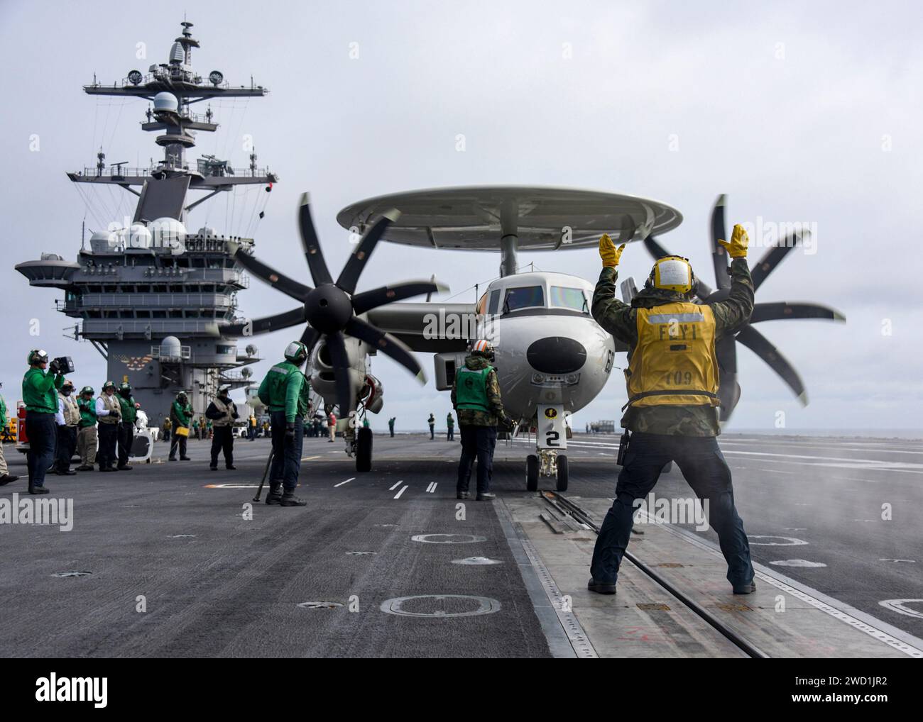 An E-2C Hawkeye prepares to launch from the aircraft carrier USS Carl ...