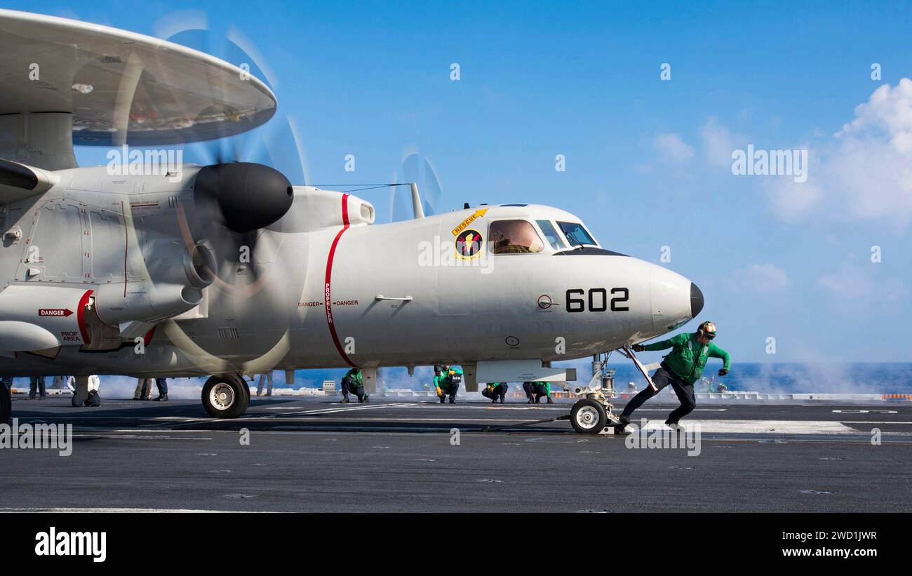 An E-2C Hawkeye prepares to launch from the aircraft carrier USS Carl ...