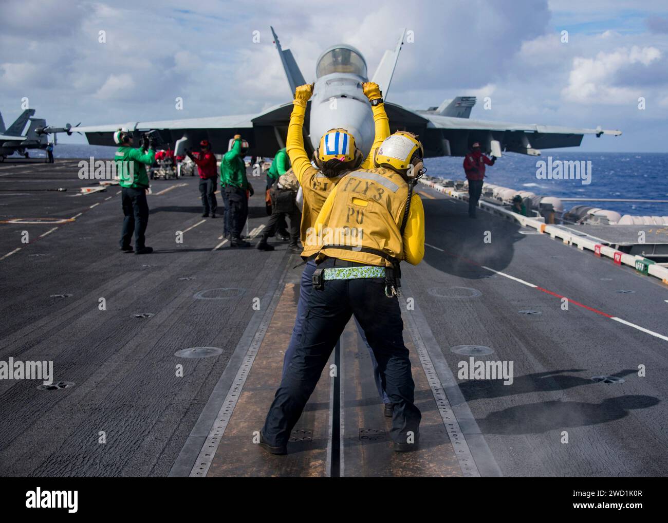 Sailors assigned to the aircraft carrier USS Carl Vinson conduct flight ...
