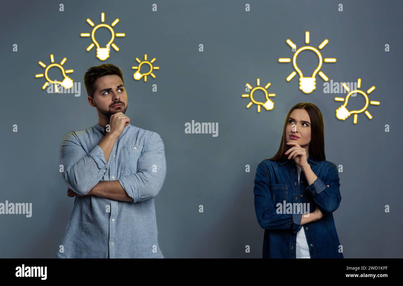 Idea generation. Thoughtful man and woman on grey background ...