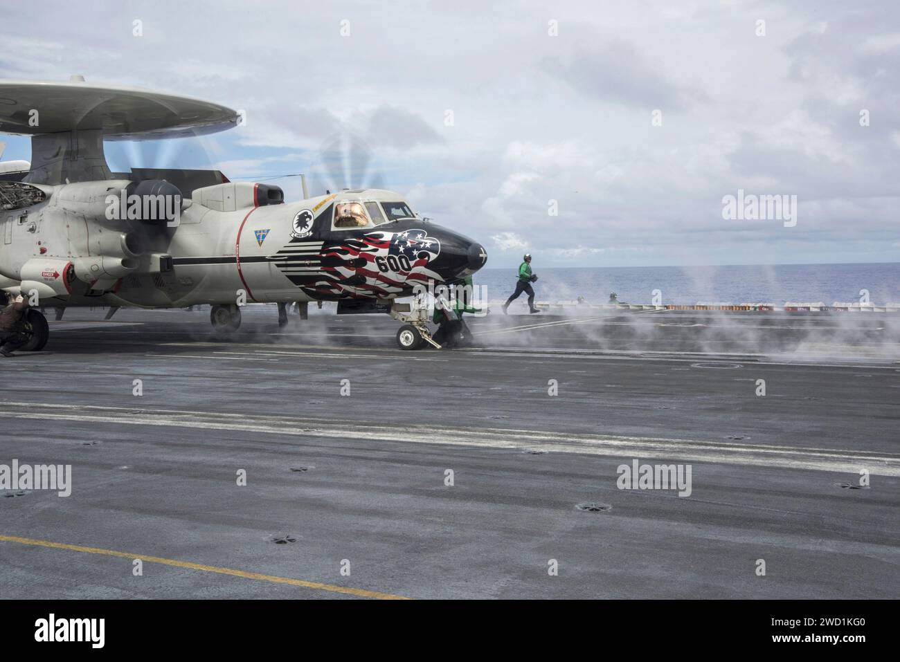 An E-2C Hawkeye early warning and control aircraft takes off from USS ...
