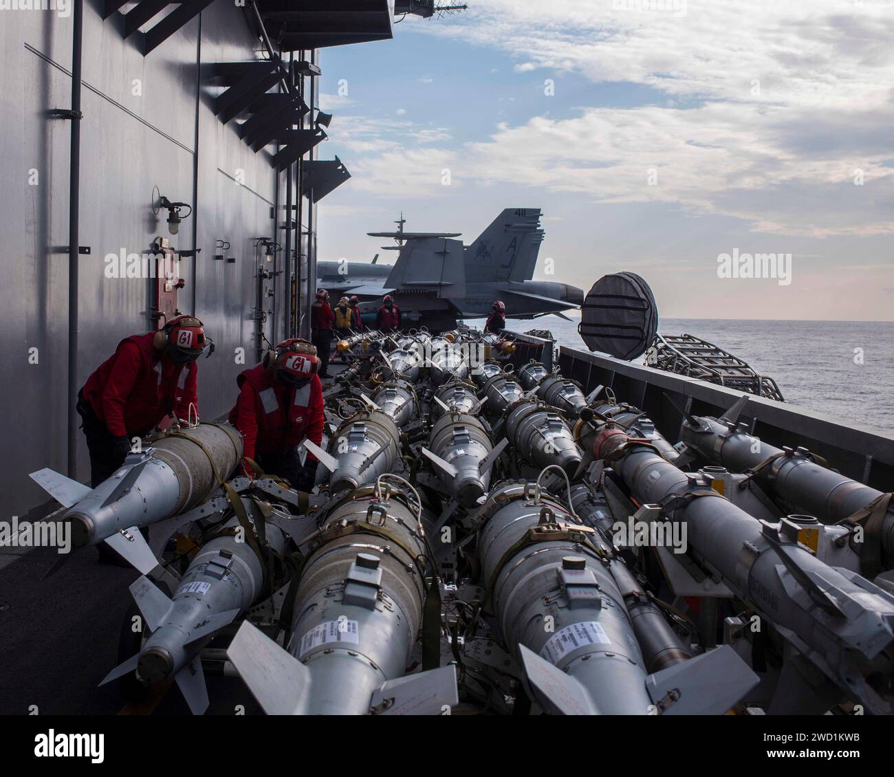 Sailors move ordnance aboard USS George H.W. Bush Stock Photo - Alamy
