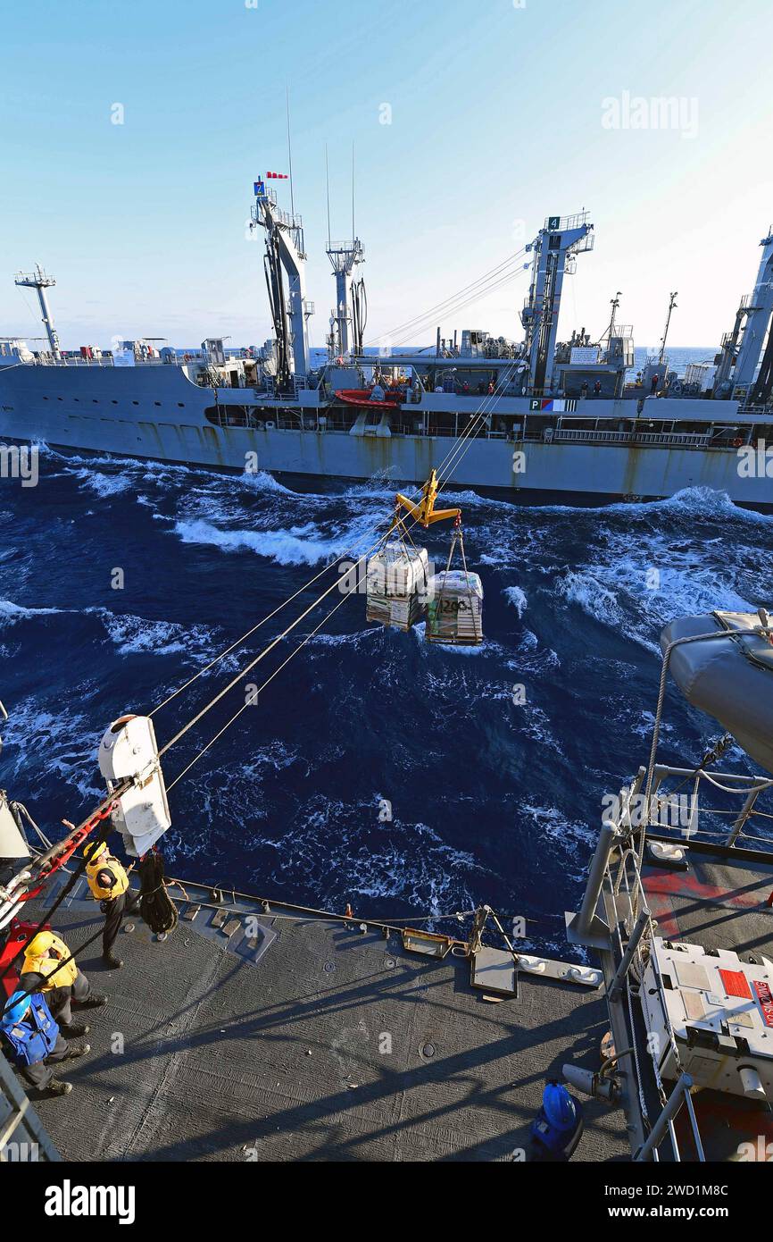 Sailors aboard USS Hue City conduct an underway replenishment with USNS ...