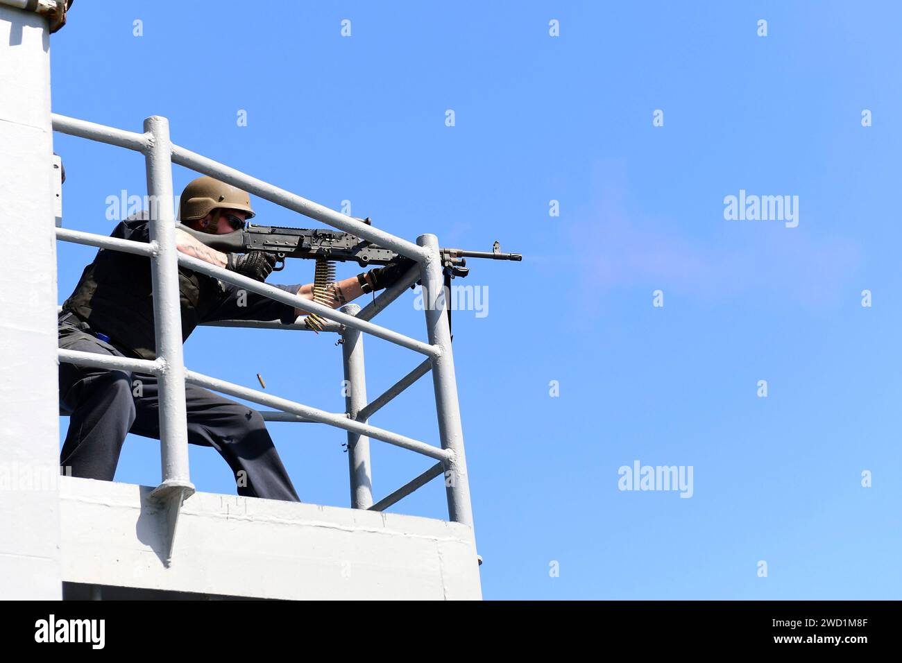 Gunner's Mate fires an M240B machine gun aboard the guided-missile ...