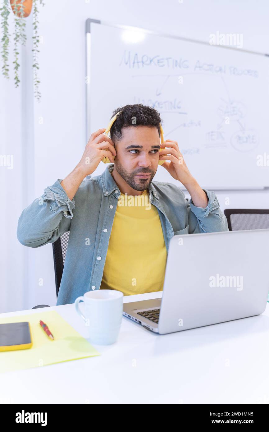 A professional prepares for a focused work session with yellow ...