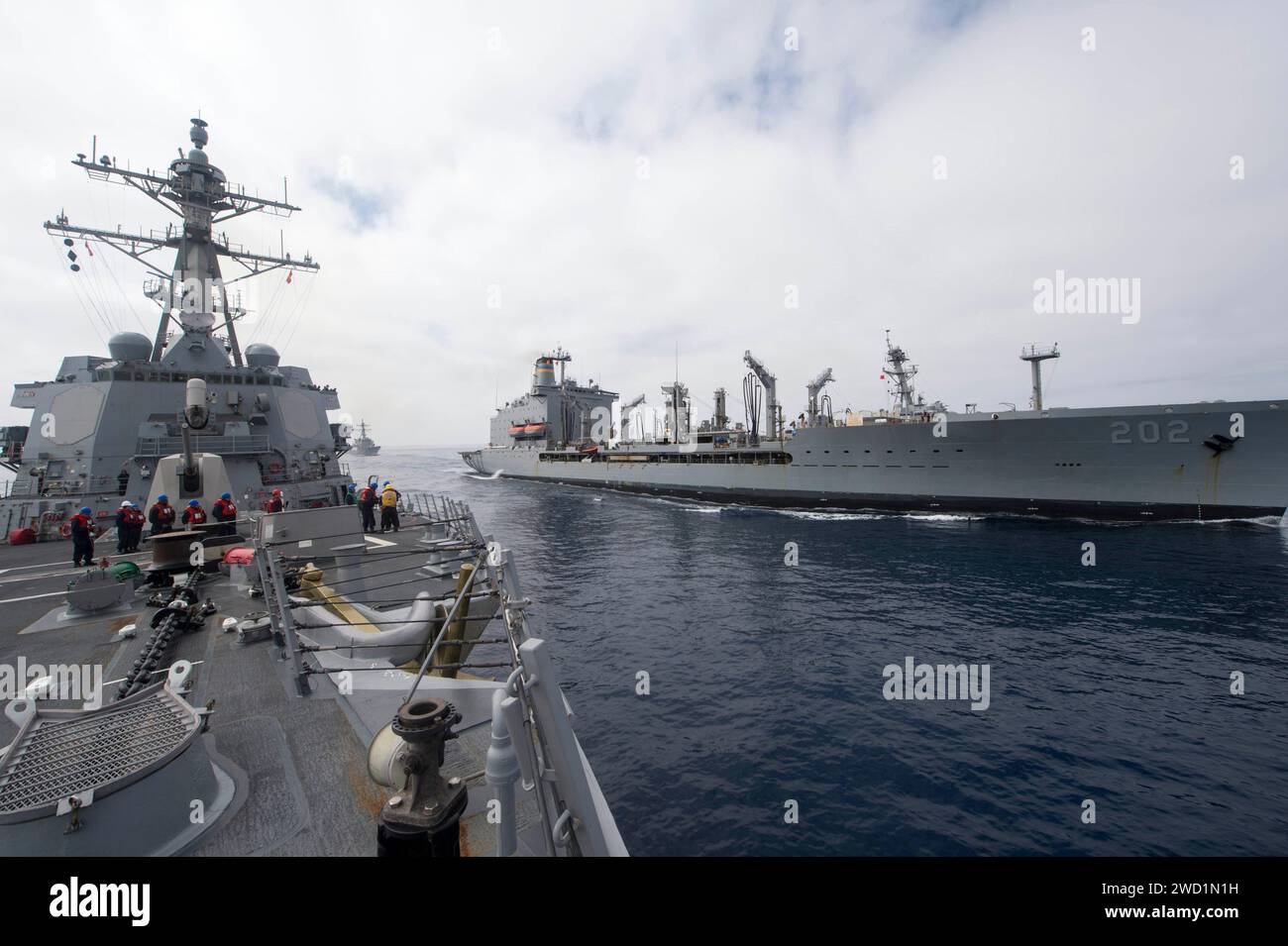 Replenishment-at-sea between guided-missile destroyer USS Howard and ...