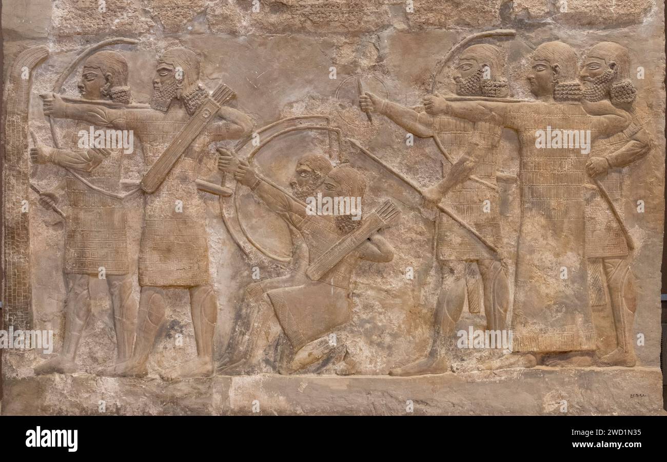carved stone reliefs of archers from the Assyrian palace of Dur ...