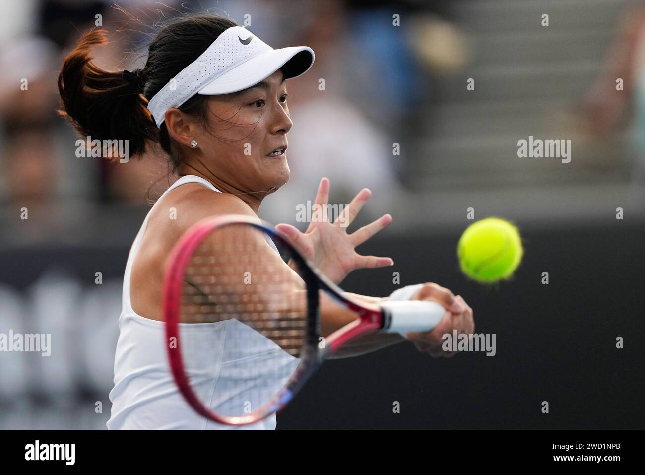 Wang Yafan of China plays a forehand return to Emma Raducanu of Britain ...