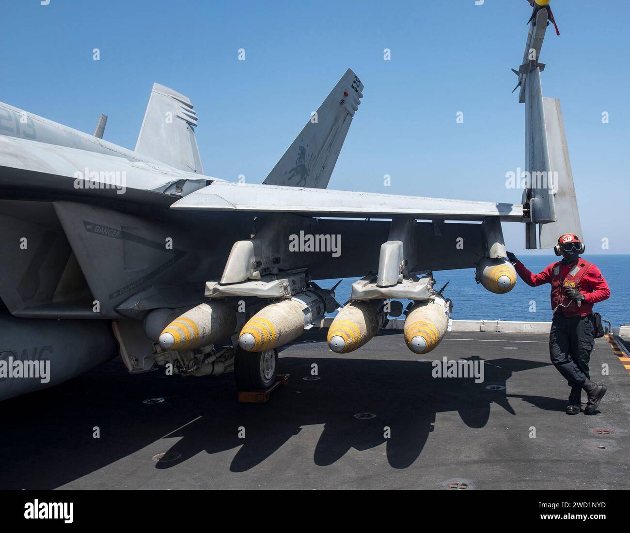 An F/A-18F Super Hornet is fully loaded with 10 GBU-32 1,000 pound ...